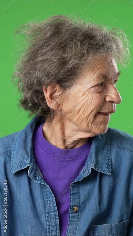 Vertical video portrait of smiling happy elderly senior old woman with ...