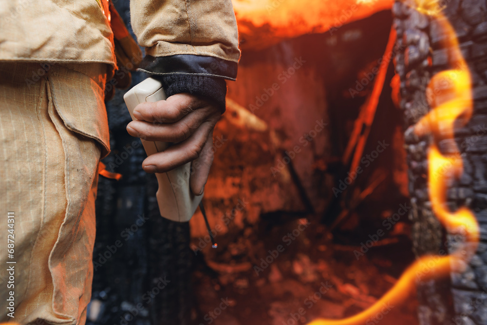 firefighter talking on radio walkie talkie with colleagues background ...