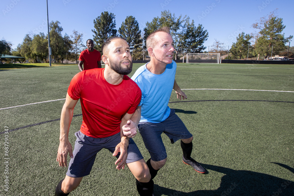 Foto de Soccer players work together as a team playing the game ...