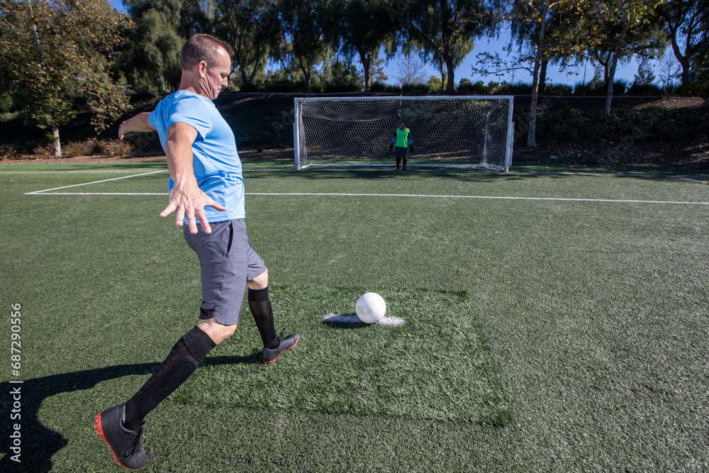 Soccer players work together as a team playing the game together. The ...