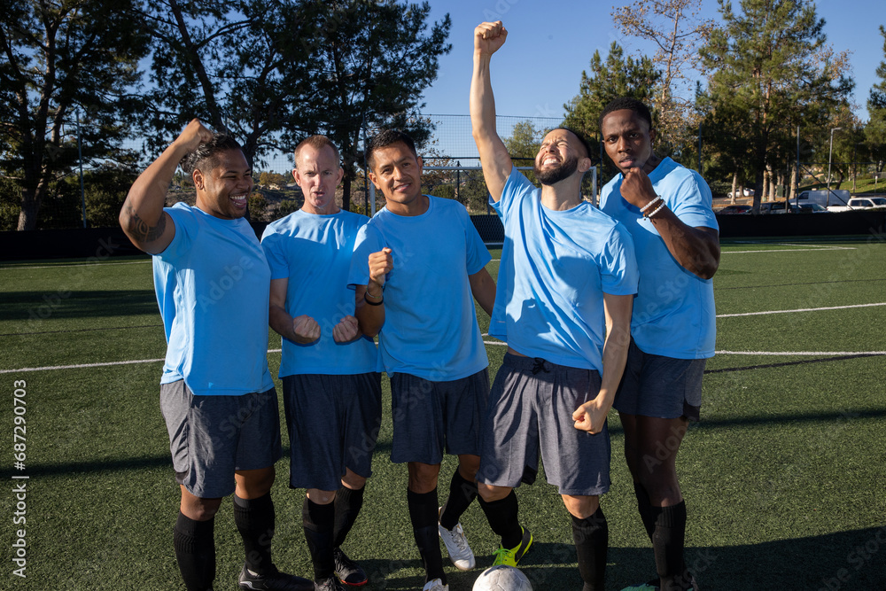 Group of five men on a soccer team. The players are standing proudly ...