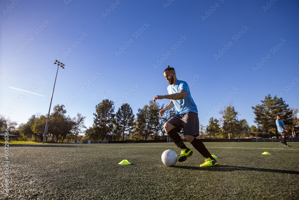 Soccer players work together as a team playing the game together. The ...
