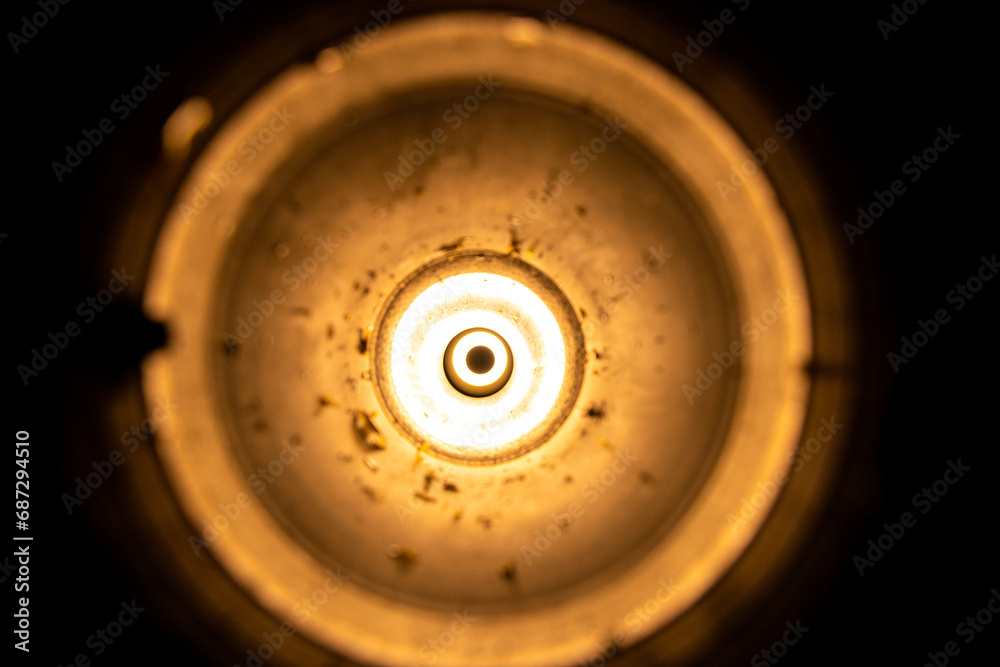 Flashlight light in an empty used anti-tank grenade launcher as a ...