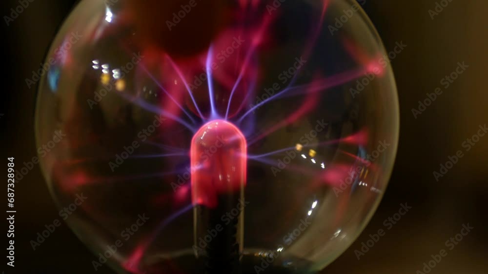 Shooting a plasma ball and a person's finger attracting an electrical ...