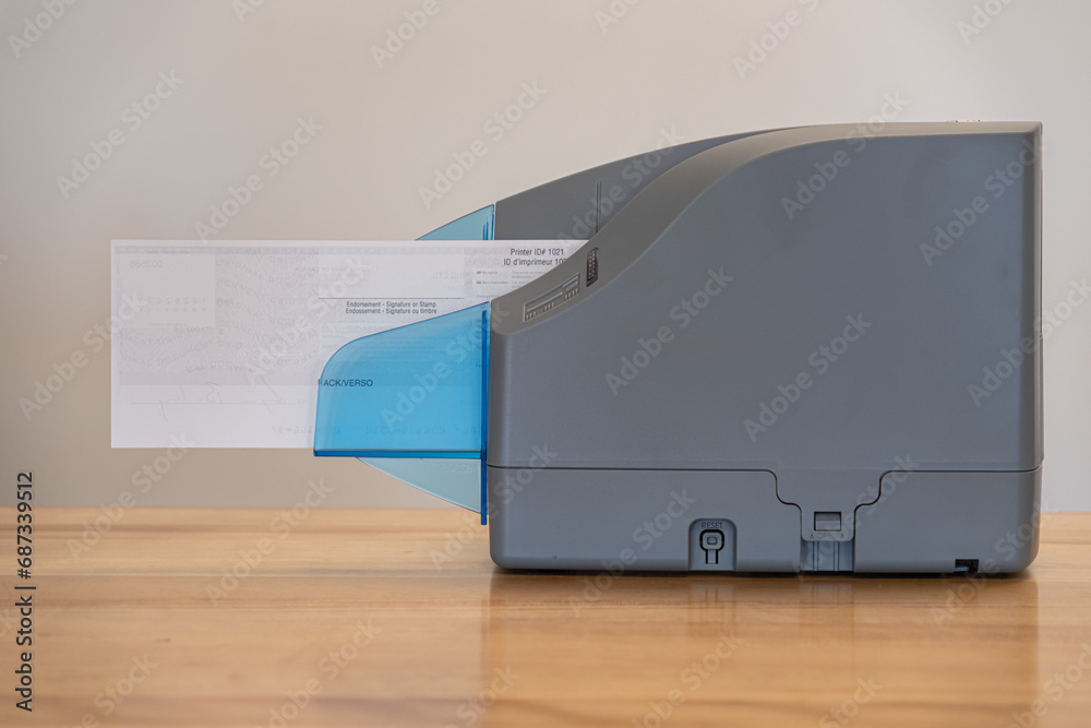 Bank Cheque scanner used to deposit cheques remotely Stock Photo ...