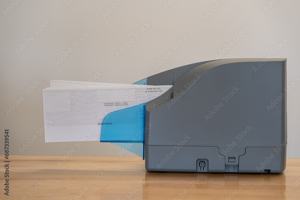 Bank Cheque scanner used to deposit cheques remotely Stock Photo ...