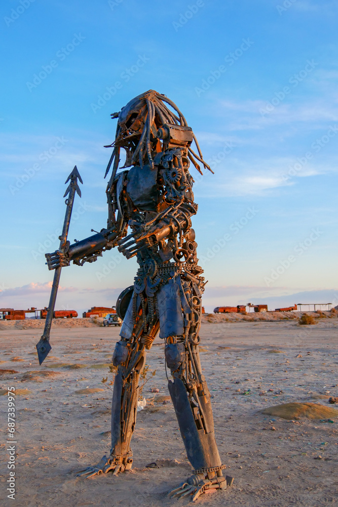 Side profile of scrap metal man with spear artwork made from recycled ...