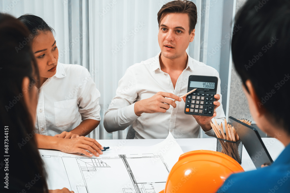 Diverse group of civil engineer and client working together on ...