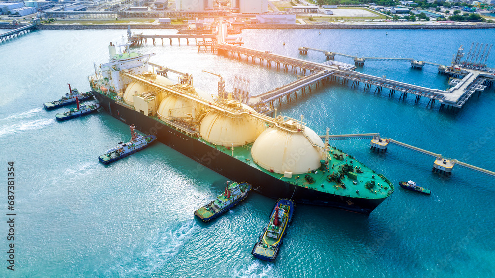 LNG (Liquefied natural gas) tanker anchored in Gas terminal gas tanks ...