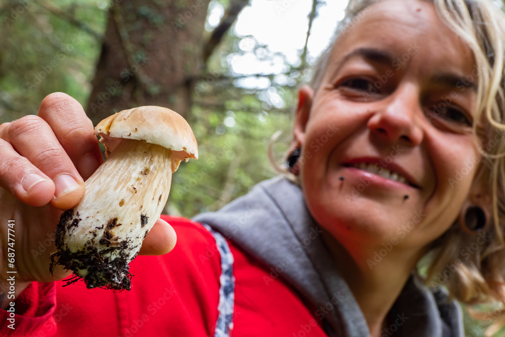 Female mushroom forager with wild Boletus mushrooms Stock Photo | Adobe ...