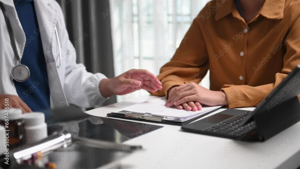 medical doctor holing patient's hands and comforting her.Kind doctor ...