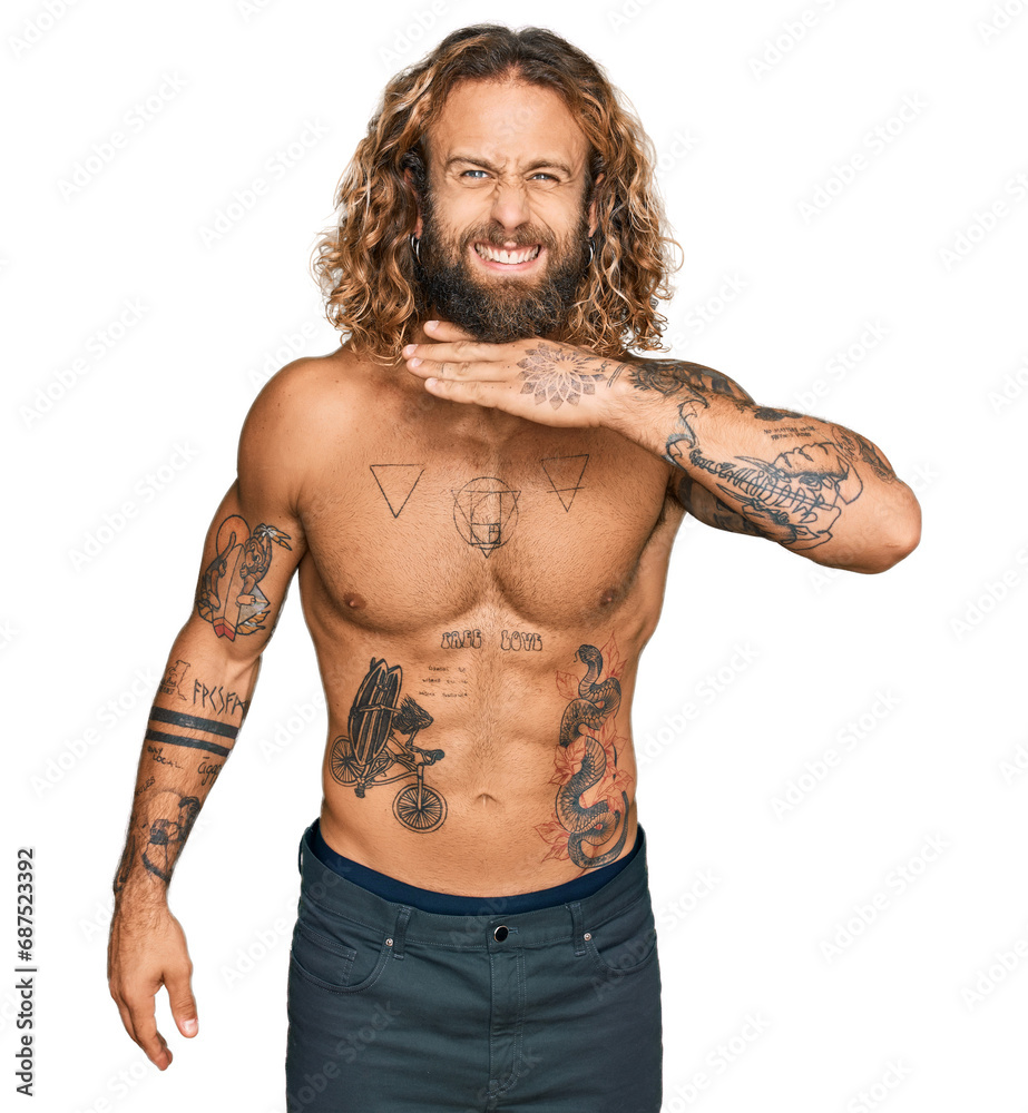 Handsome man with beard and long hair standing shirtless showing ...