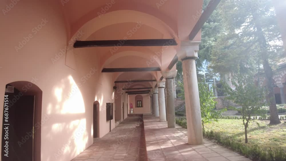 Camera movement moving through the colonnaded madrasa courtyard. These ...