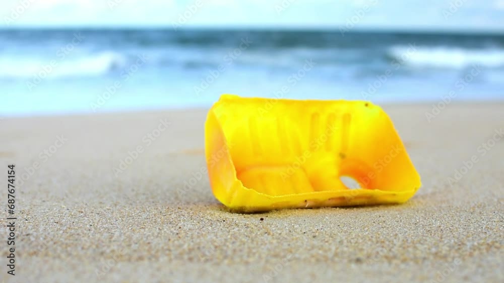 Yellow Plastic Garbage Washed Up on Beach in Brazil, Ocean Waves Focus ...
