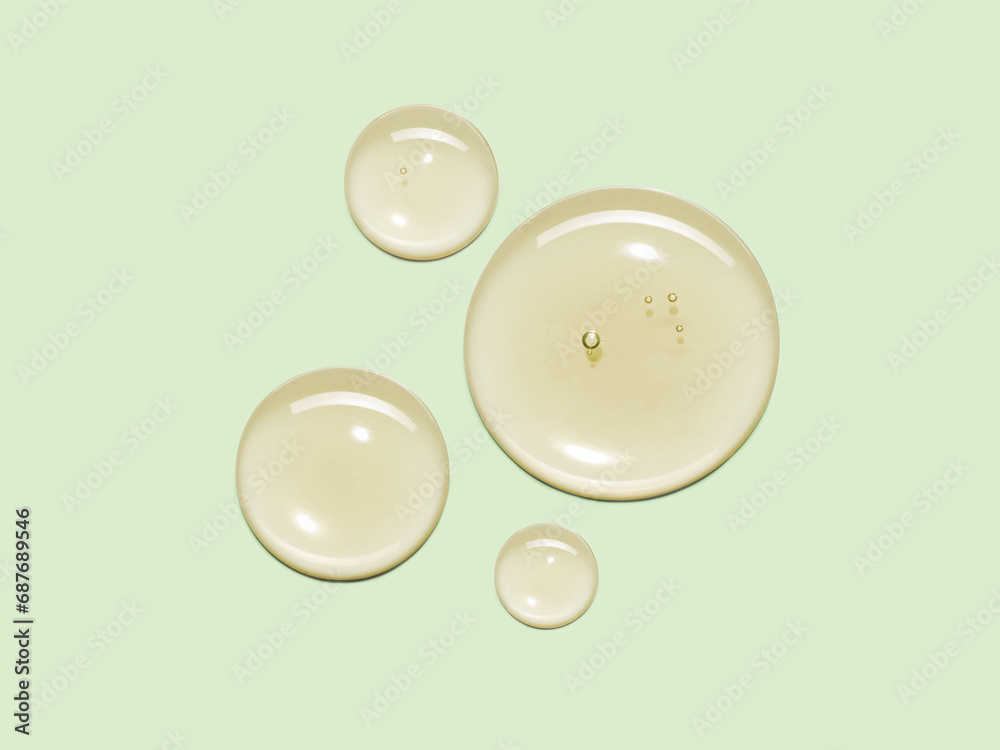 Yellow serum oil sample swatch round shape texture isolated on pastel ...