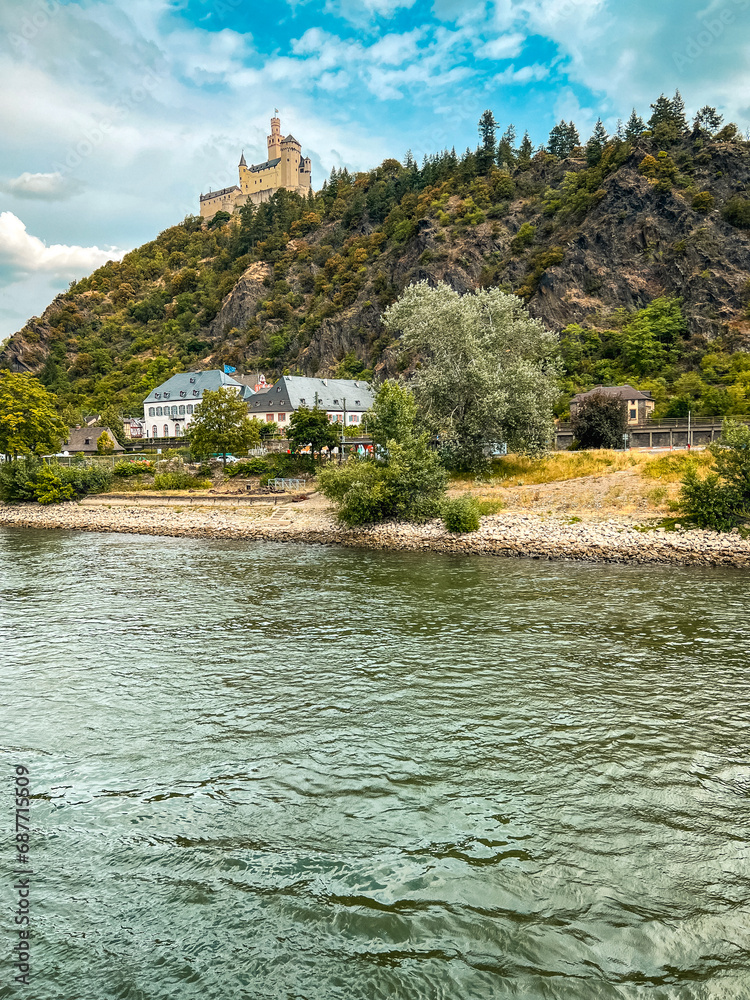 Traveling along the Rhine River with scenic views of the village of ...