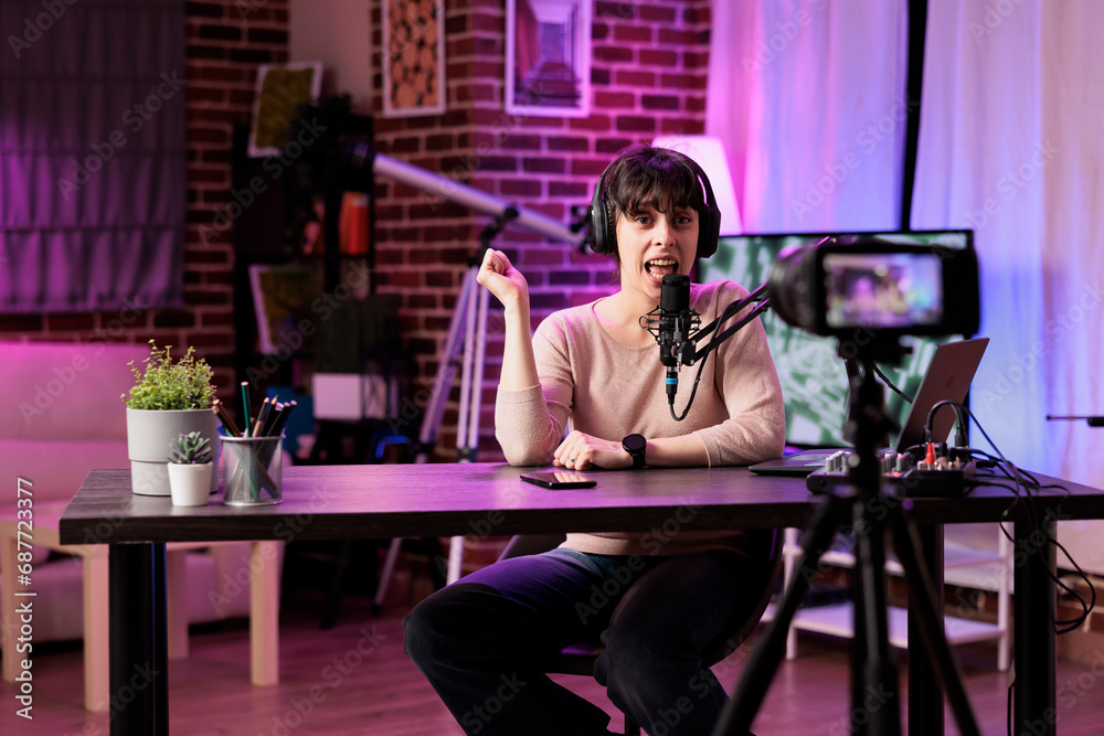 Vlogger recording internet show using modern camera, talking about ...