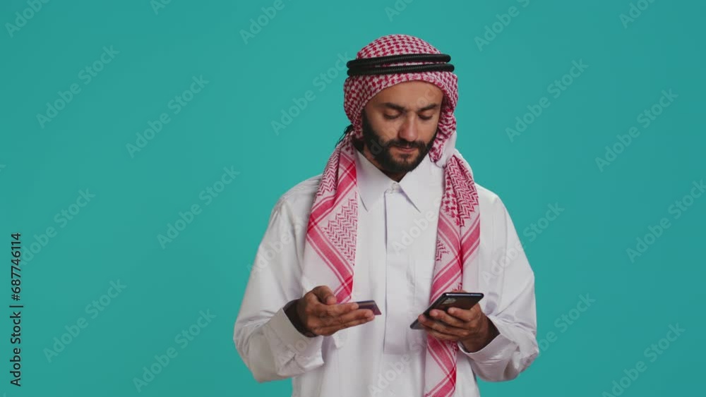 Arab person adding card numbers on website, doing online shopping spree ...