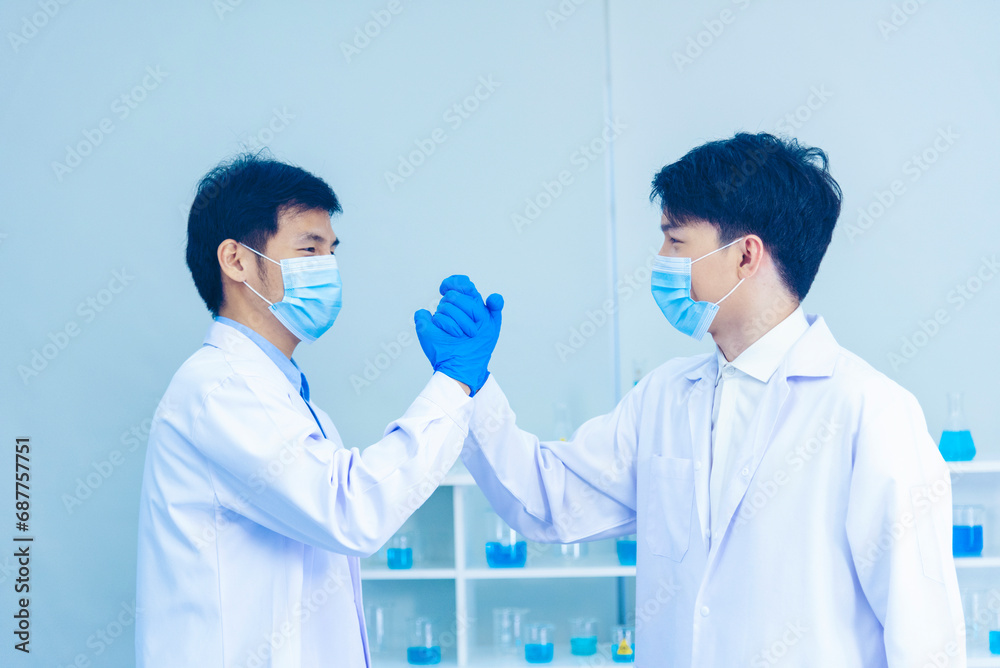 Foto de Two asian scientist men team high five partner shake hands together. Science Men ...