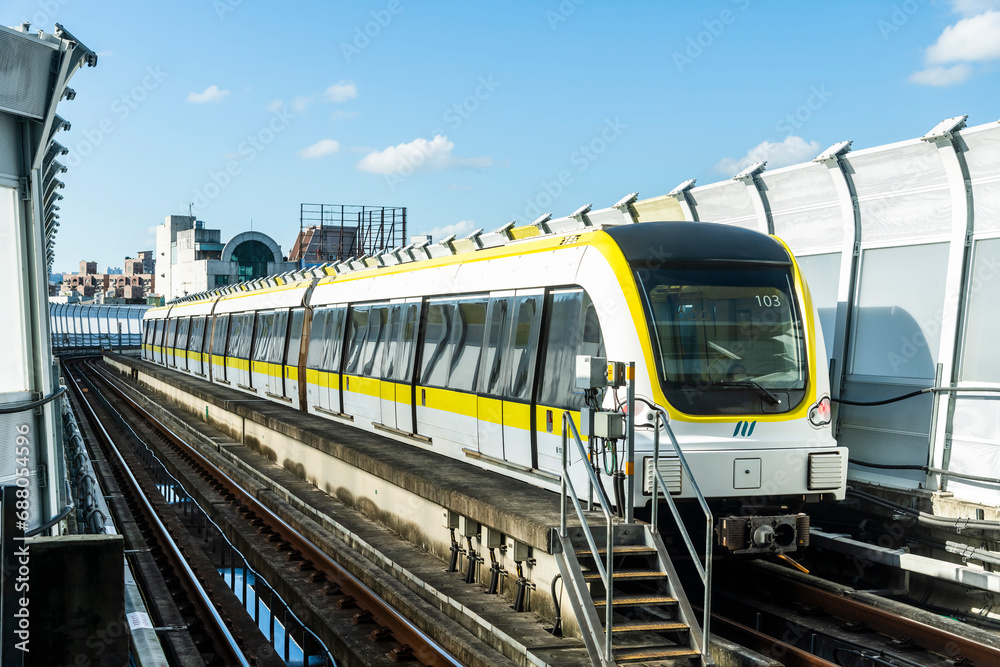 New Taipei City, Taiwan- November 21, 2023: A train traveling on the ...