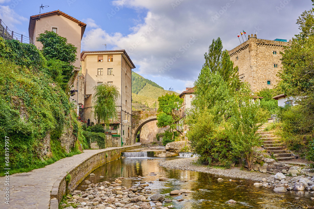 Potes town with Deva river in its path and Torre del Infantado in the ...