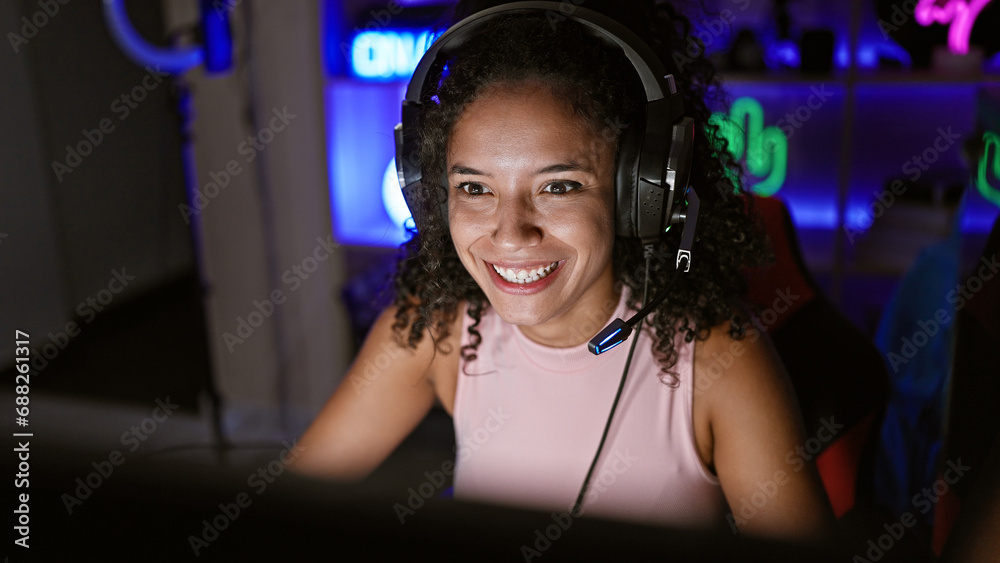 Confident and beautiful young hispanic woman streamer smiling as she ...