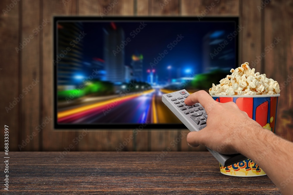 Film on tv screen and bowl of popcorn Stock Photo | Adobe Stock