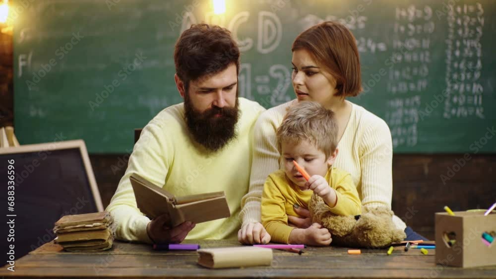Cute clever boy study. Cute little kid boy learning with parents ...