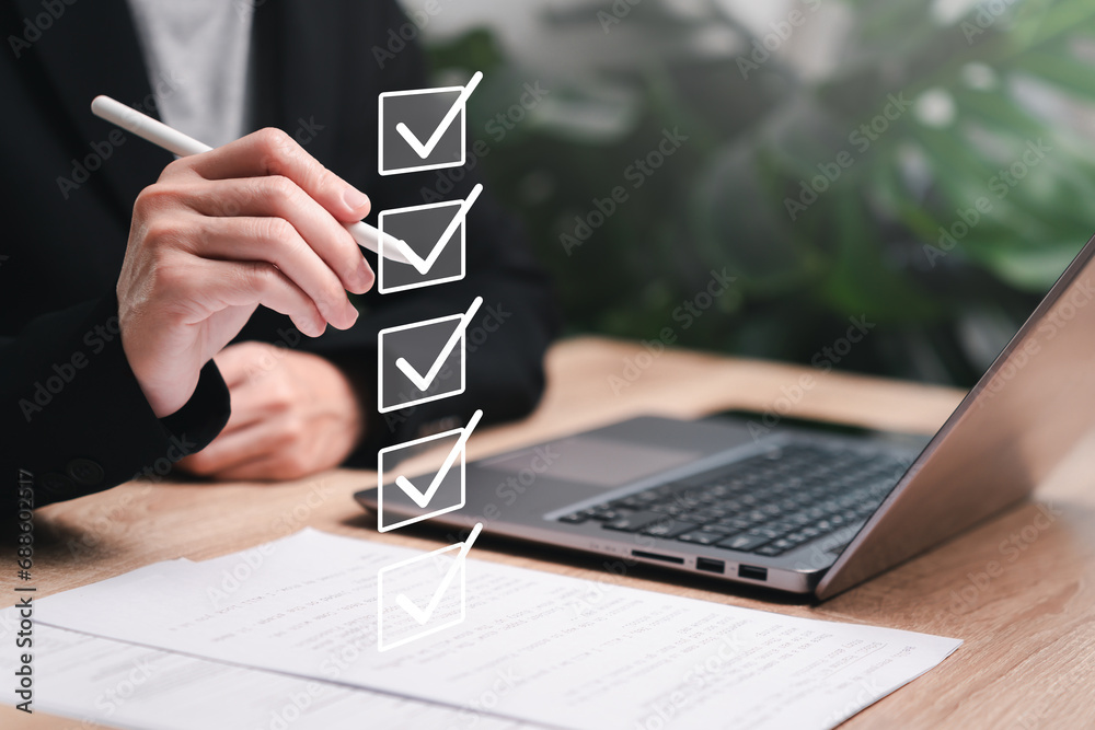 Electronic checklist concept, Business Woman checking on checklist ...