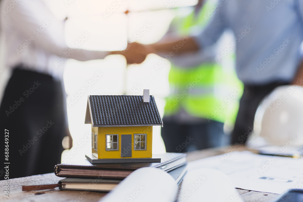 Collaboration of engineers, architects and contractors. Architects hand ...