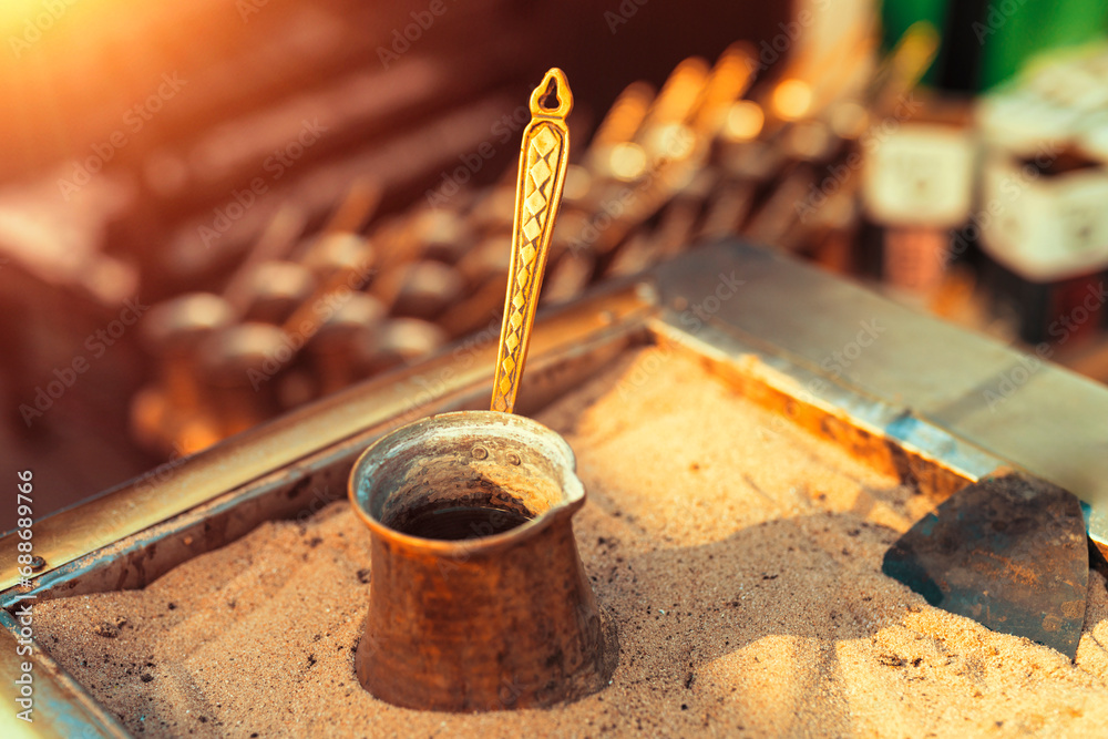 Traditional delicious Turkish dibek coffee being prepared in a copper ...