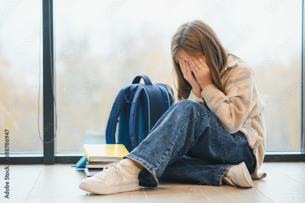 Bullying, discrimination or stress concept. Sad teenager crying in ...