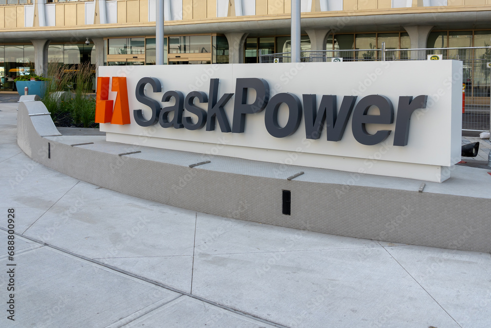 SaskPower logo and sign in front of SaskPower headquarters building in ...