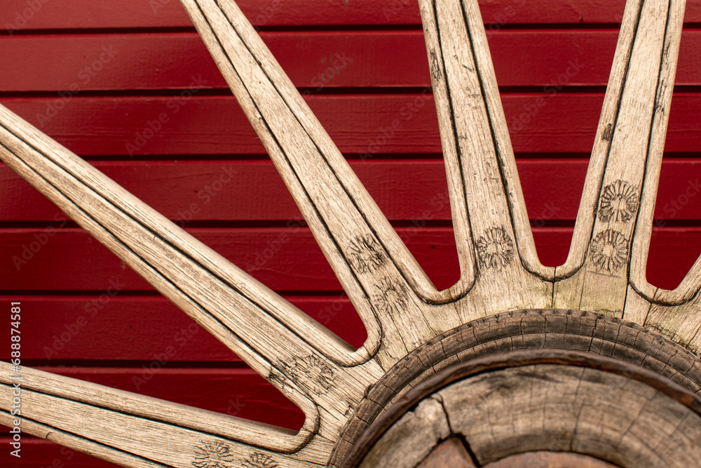 Wood Wheel Spindles Infront of Red Slat Wall Stock Photo | Adobe Stock