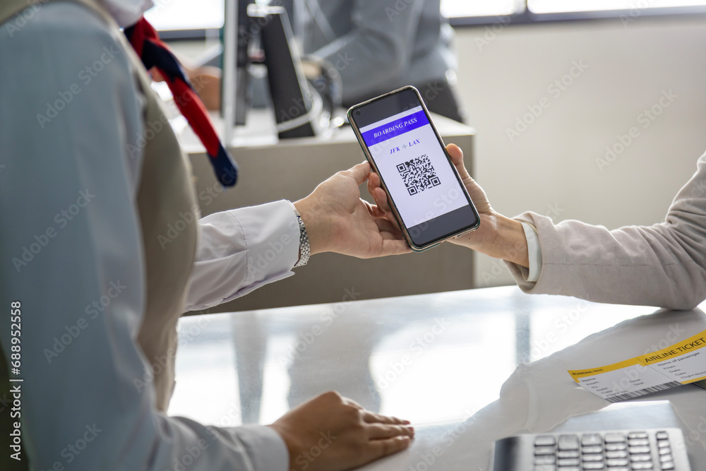 Passenger is showing online check in qr code boarding pass to the ...