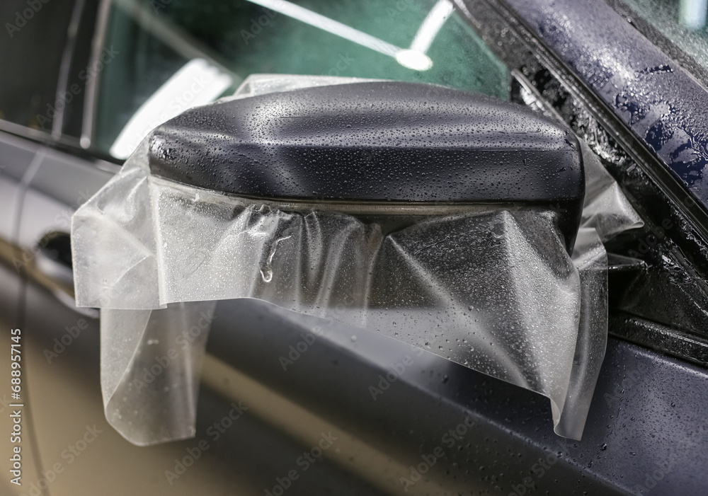 The process of installing PPF on the side mirror. The process of ...