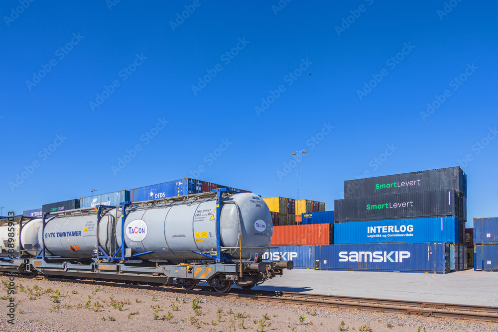 Tank wagons and containers at a railway yard Stock Photo | Adobe Stock