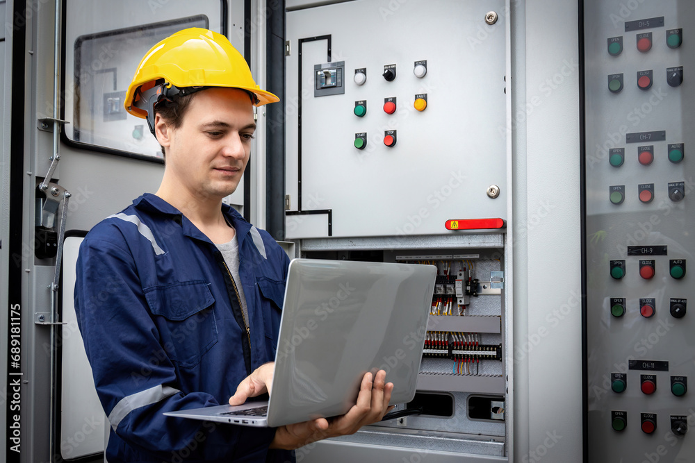 Electrical engineer working in control room. Electrical engineer man ...