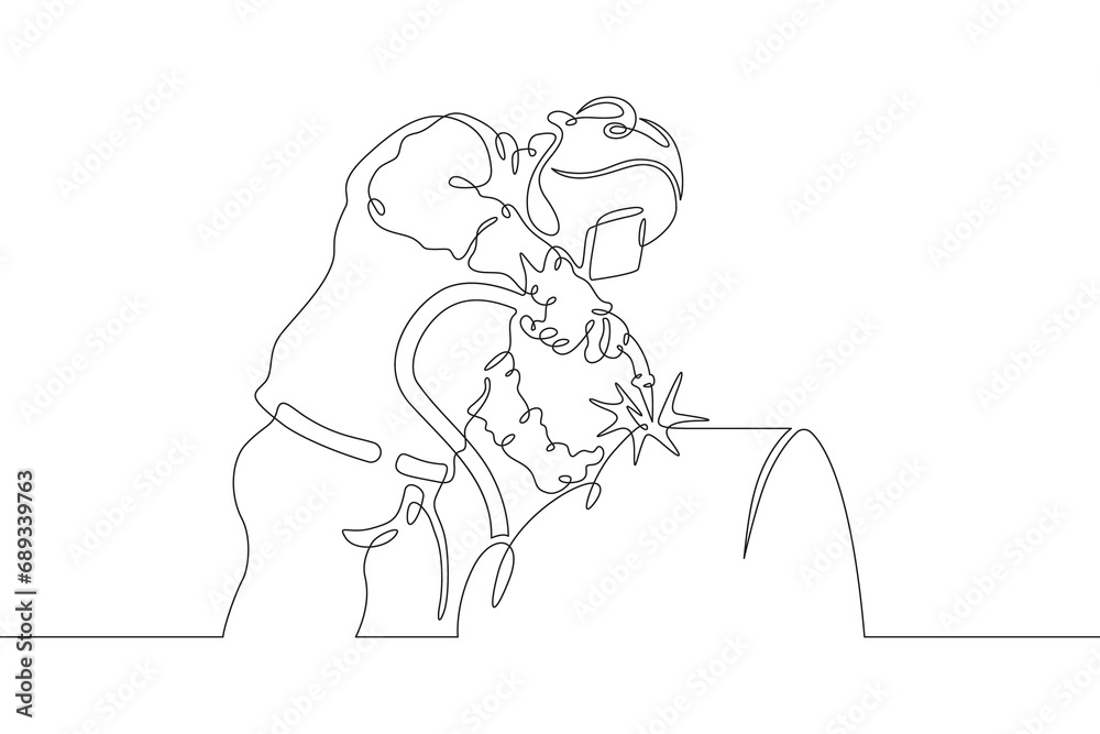 Welder worker. Welding metals at a construction site. Specialist welder ...