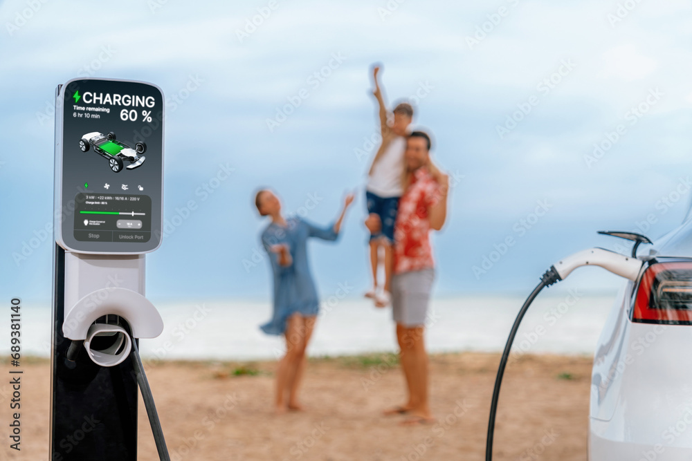 Alternative family vacation trip traveling by the beach with electric ...