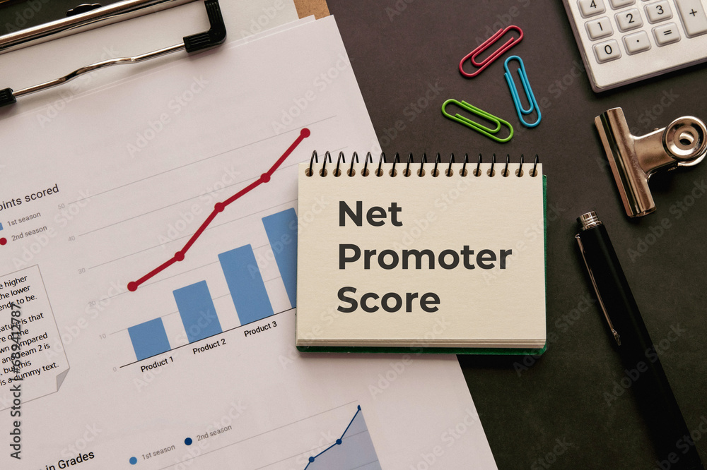 There is notebook with the word Net Promoter Score. It is as an eye ...