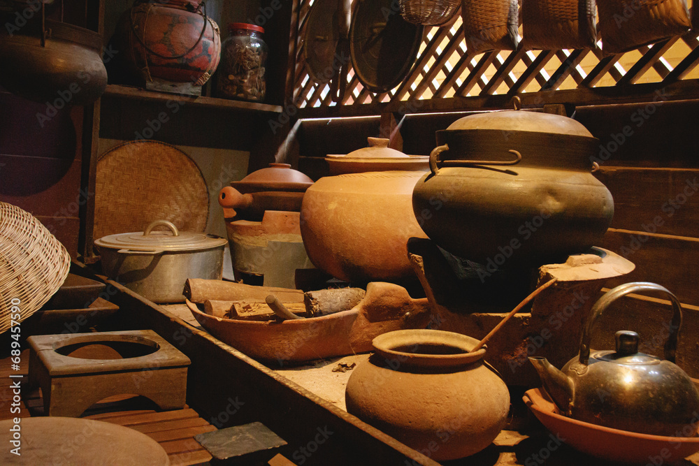 Clay pots and wooden kitchen utensils in a rustic yet sustainable ...