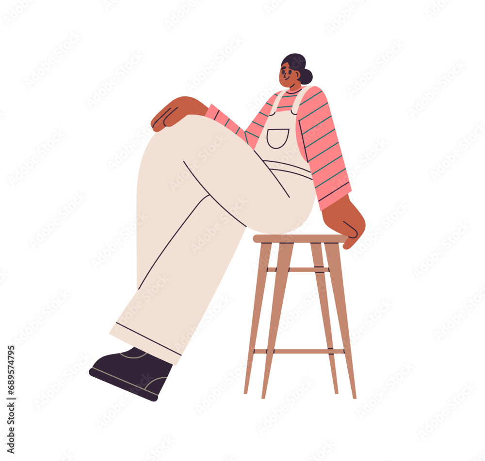 Young black woman sitting on stool, posing for photo shoot. Modern ...