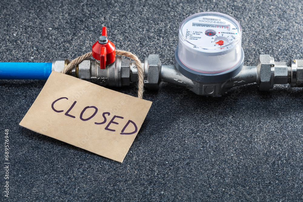 water tap on the pipe with sign board closed. disconnecting water. save ...