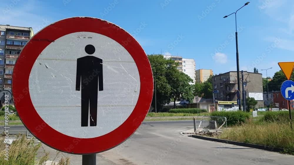 No pedestrians. View of pedestrians prohibited sign and roadblock in ...