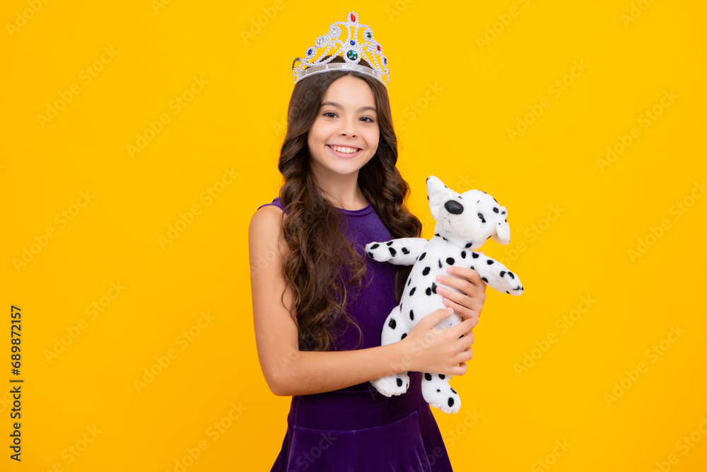 Little queen wearing golden crown. Teenage girl princess holding crown ...