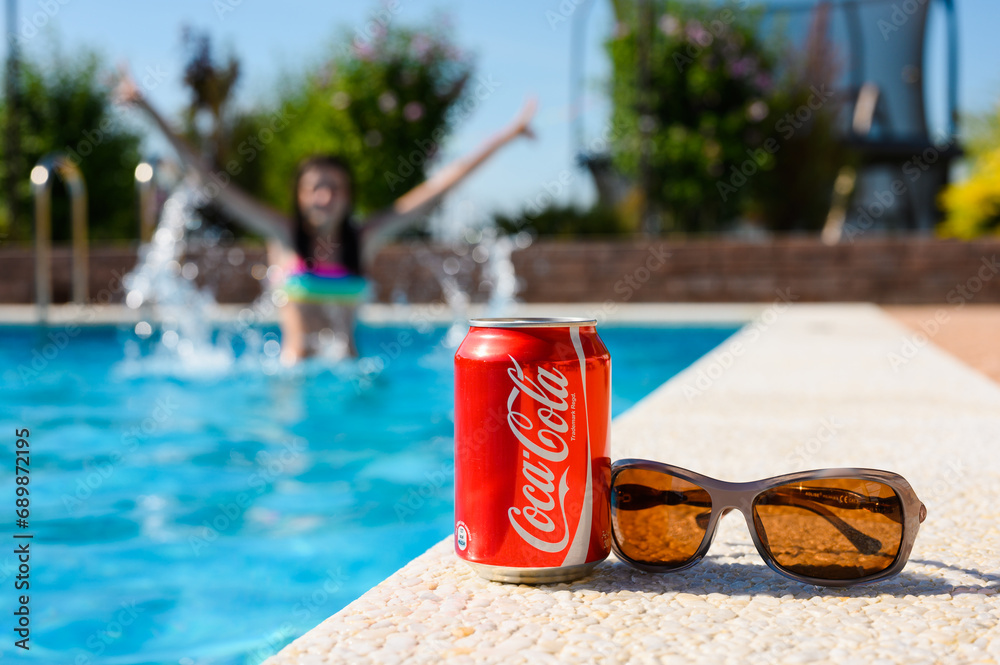 Anapa, Russia - July 18, 2023: Relaxing by the pool with Coca-Cola soft ...