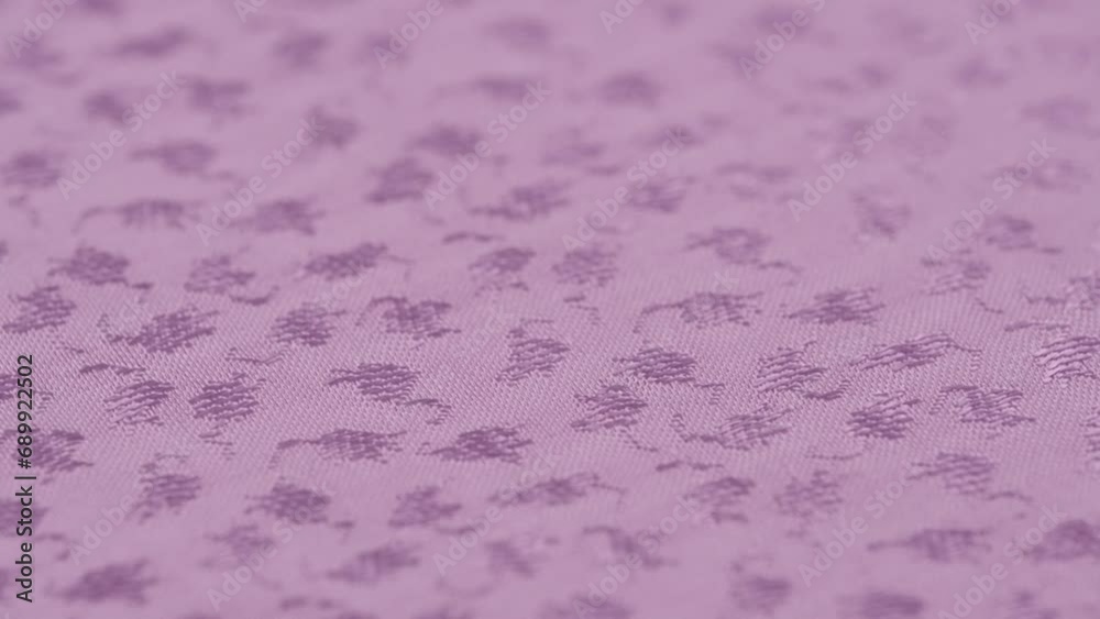 Vidéo Stock rotation of plain jacquard fabric of lilac color in closeup ...