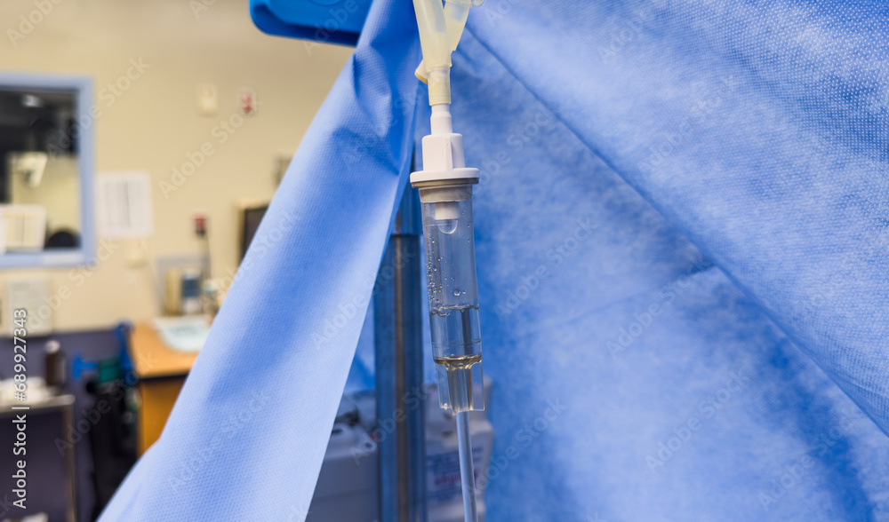 hospital intravenous infusion with medication dripping into tubing ...