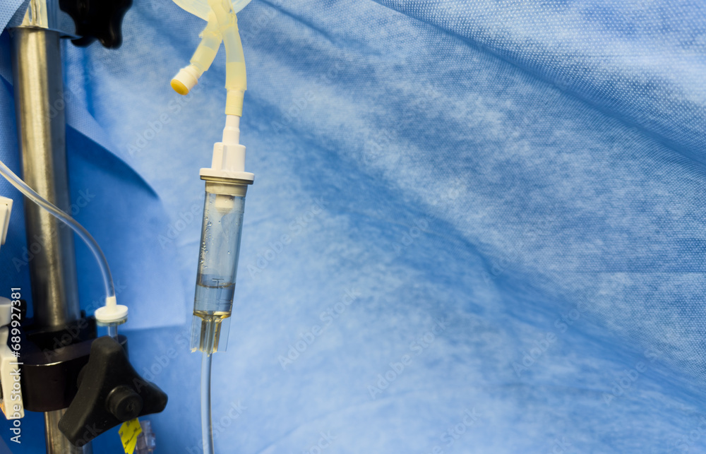 hospital intravenous infusion with medication dripping into tubing ...